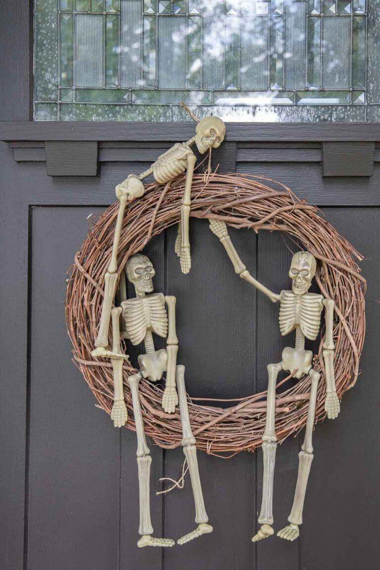 How to Make a Halloween Wreath With Dollar Store Skeletons - Twelve On Main