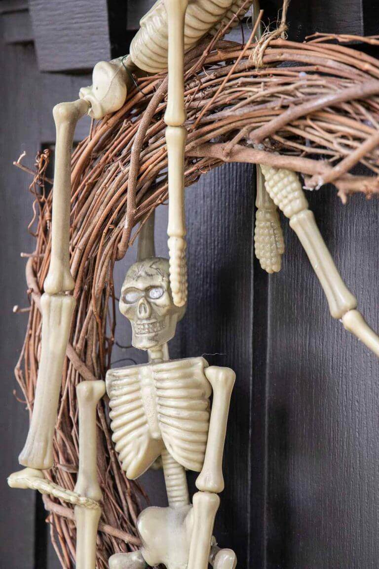 How to Make a Halloween Wreath With Dollar Store Skeletons - Twelve On Main